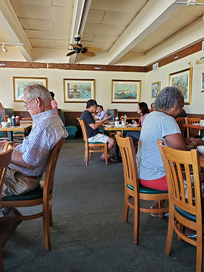 Solo diners find community at the counter, where breakfast becomes a spectator sport worth watching.