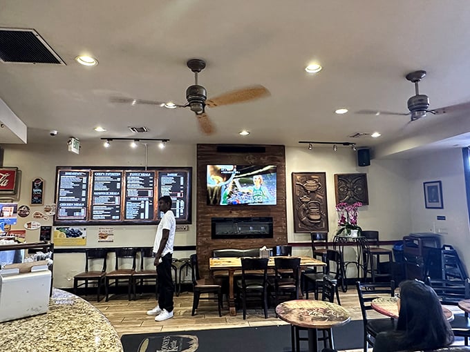 A glimpse into the dining experience where comfort food meets casual elegance &ndash; notice the fireplace that adds unexpected warmth.