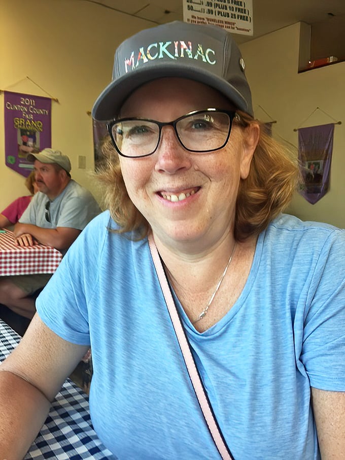 Happy diners are the best advertisement. That smile says "I've found barbecue worth driving across state lines for."