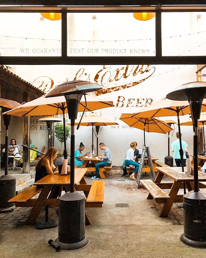 The outdoor dining area at dusk&mdash;where string lights, cold drinks, and the promise of smoked meat create the perfect urban oasis.