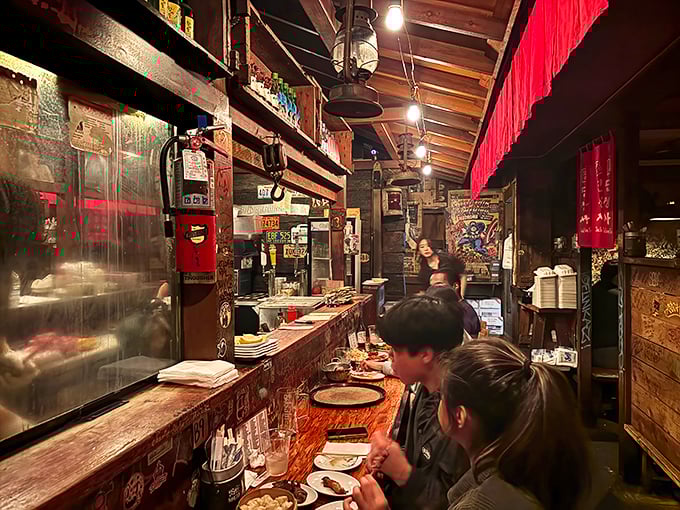 Where strangers become friends over shared plates and soju. The best conversations happen when everyone's reaching for the last piece.