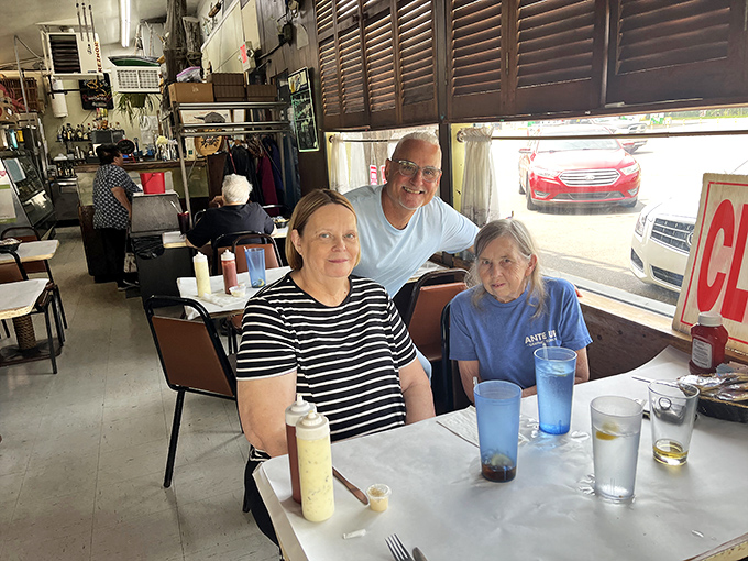 The dining room where seafood stories are shared and memories made. Notice those rope-wrapped table bases&mdash;nautical touches everywhere.