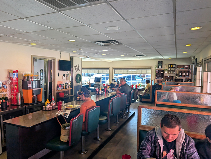 Counter seating: where strangers become friends over pancakes and coffee. The heart of any true American diner experience.