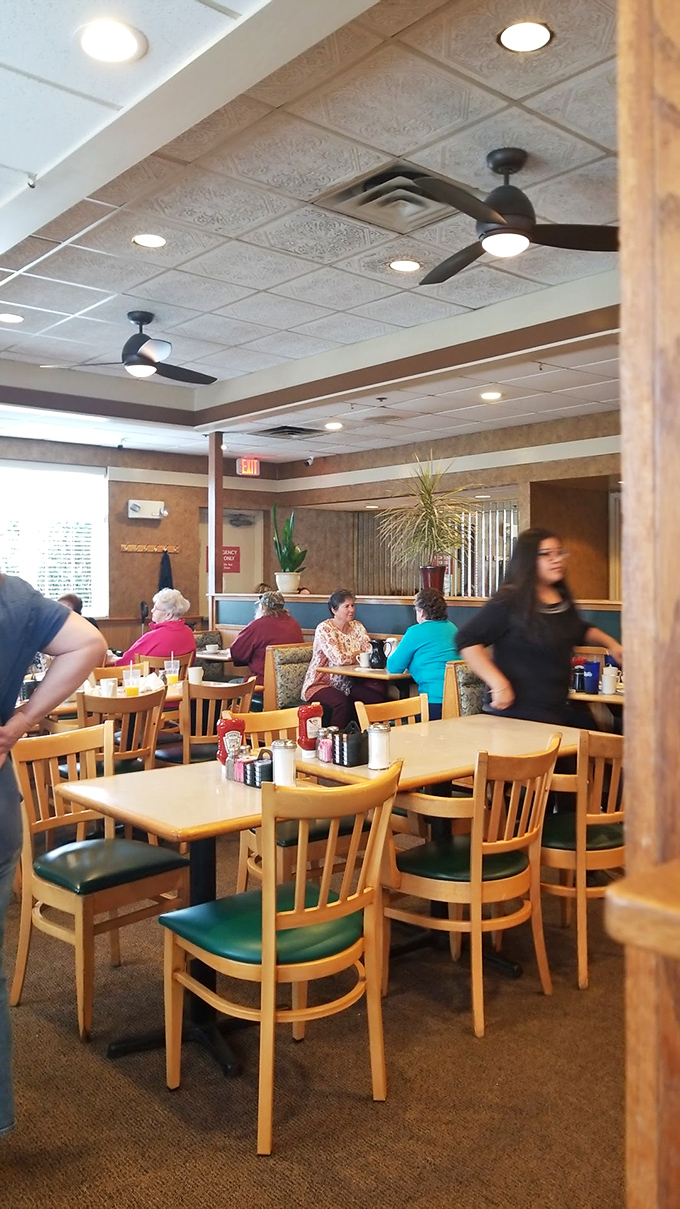 Where strangers become neighbors over coffee and toast &ndash; the dining room hums with the soundtrack of community.