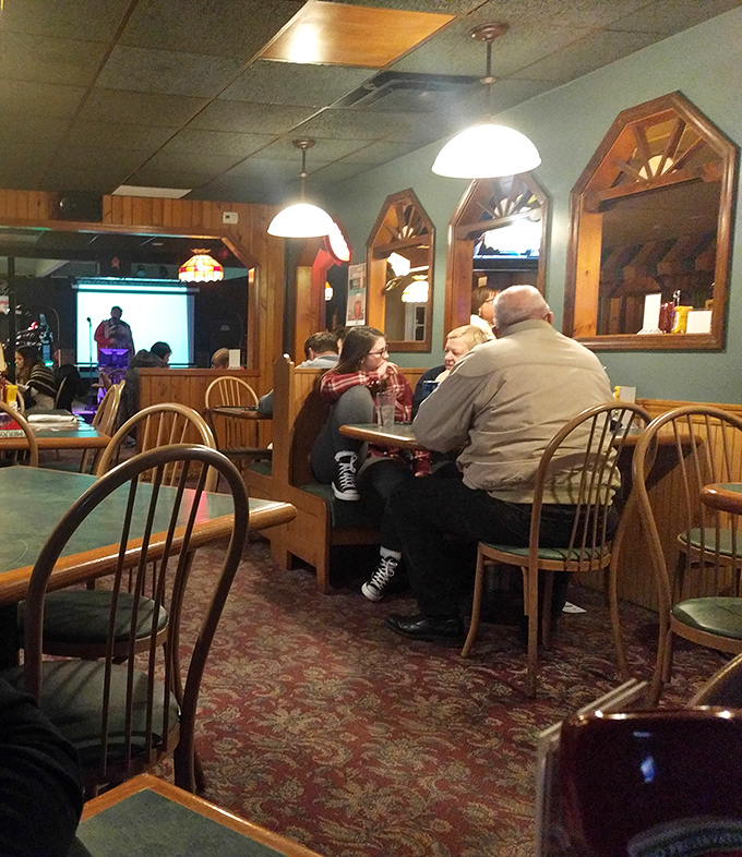 The dining room's wood-framed mirrors and cozy booths create that perfect "everybody knows somebody who knows everybody" small-town vibe.