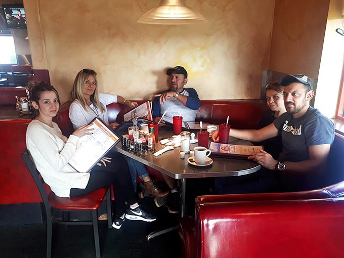 Where strangers become temporary family, united by the universal language of "pass the syrup, please."