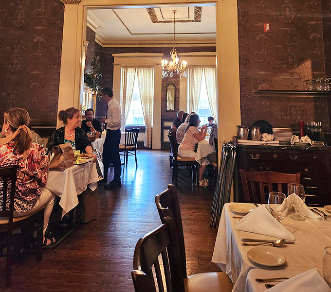 In the warm glow of Dante & Luigi's dining room, conversations flow as freely as the wine, creating the soundtrack of a perfect Italian meal.