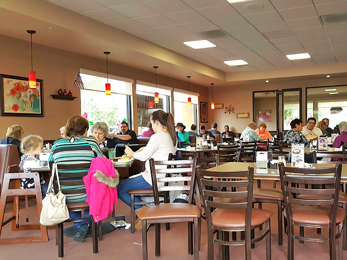 The dining room hums with the symphony of clinking forks and conversation &ndash; the soundtrack to community happening over coffee refills.