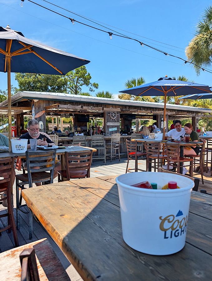 The outdoor deck&mdash;where strangers become friends and cold beverages taste twice as good under those signature blue umbrellas.