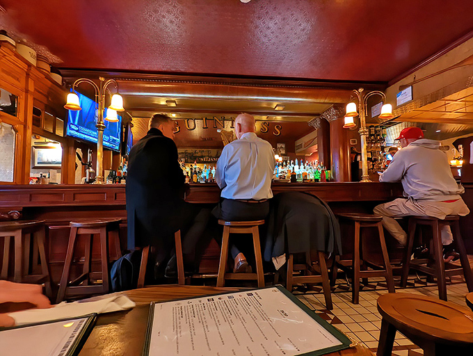 The bar scene at The Ugly Oyster&mdash;where strangers become friends and friends become family, all over properly poured pints and shared stories.