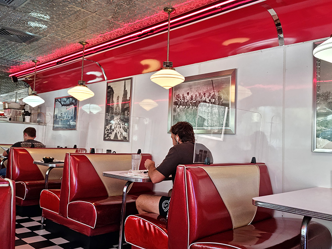 Red booths cradle diners in vinyl comfort while vintage photographs on the walls remind us that good food never goes out of style.
