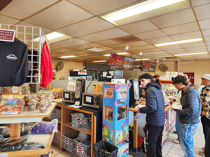 Where pastry pilgrims gather. That woman on the right is contemplating whether to order one roll or a dozen—we know that look.