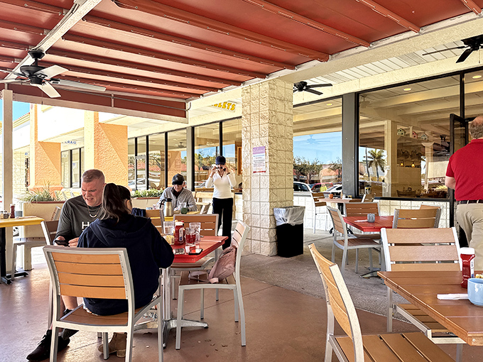The covered patio offers al fresco dining without the sunburn. Perfect for people-watching while debating whether to order seconds.