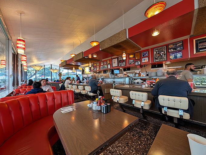 Red vinyl booths and vintage lighting create the perfect backdrop for conversations that somehow feel more meaningful than anywhere else.
