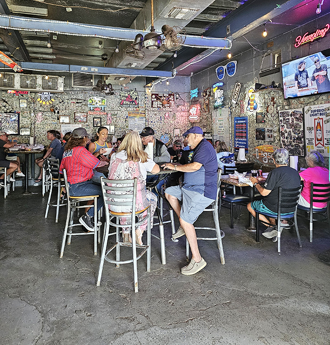 The dollar-papered walls tell stories of visitors past, while locals and tourists bond over the universal language of fresh seafood.