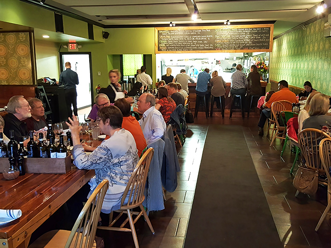 A bustling dinner service where conversations flow as freely as the wine&mdash;this is community happening around food.