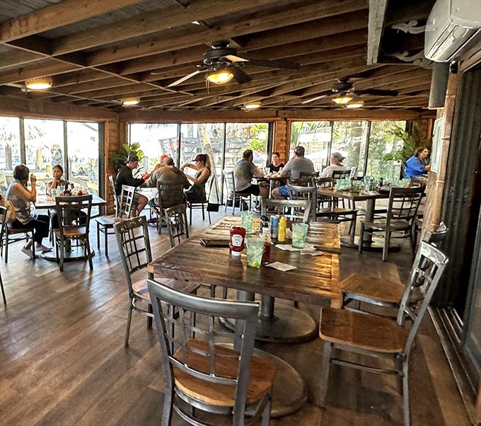 Where locals and tourists become indistinguishable, united by the universal language of "pass the hush puppies, please."