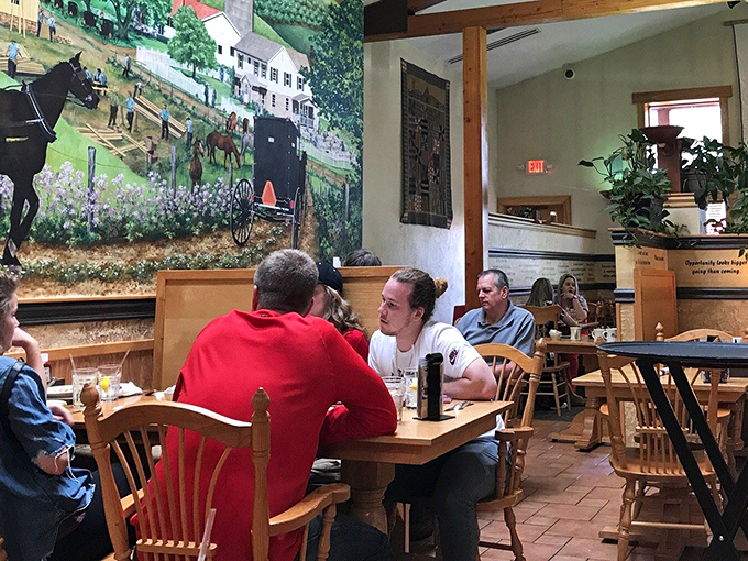 Where locals gather to break bread and share stories beneath murals depicting simpler times. This is community in edible form.