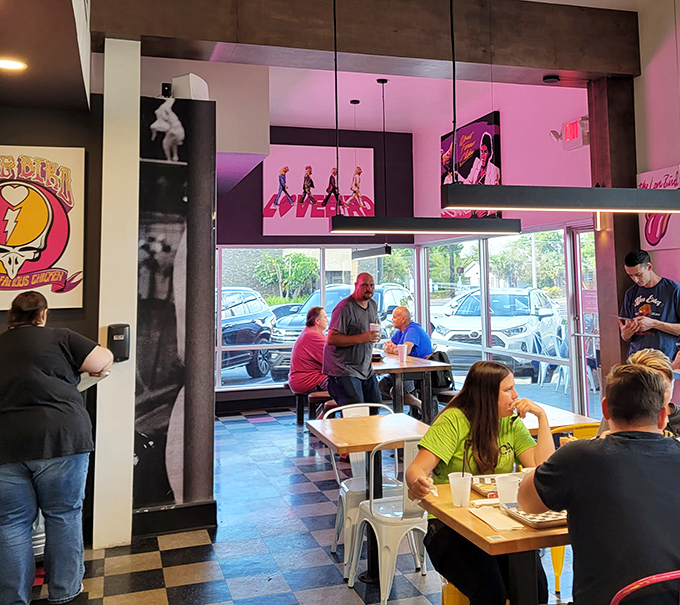 Where chicken pilgrims gather to worship at the altar of perfectly fried poultry. The pink chairs are just part of the experience.
