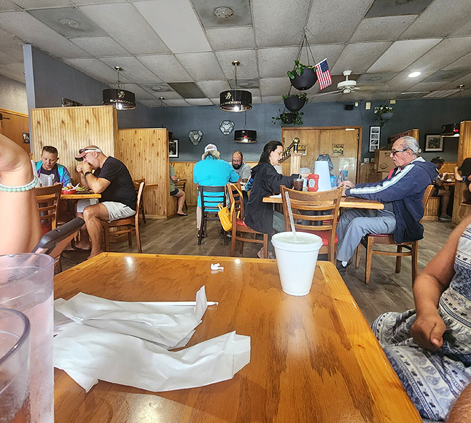 A dining room filled with locals who know the secret – great food doesn't need white tablecloths or servers who introduce themselves with "I'll be taking care of you today."