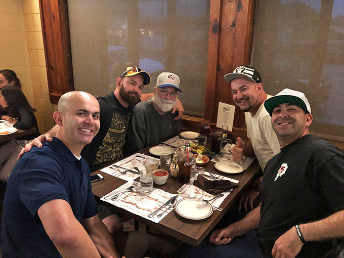 Where strangers become friends over shared appreciation of spectacular meat. The smiles tell you everything you need to know.