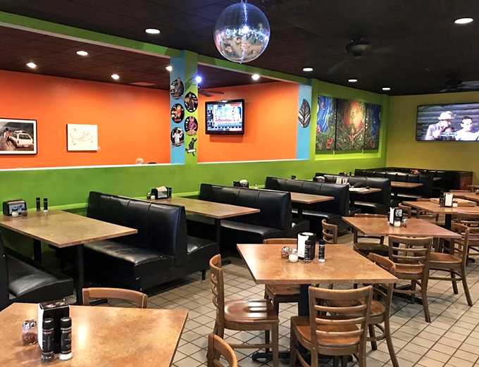 Booths, tables, and that signature disco ball create an atmosphere that's equal parts funky and comfortable. Pizza tastes better in technicolor.