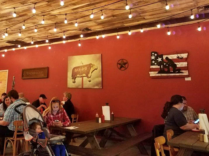 Red walls adorned with BBQ art and string lights create the perfect backdrop for the main attraction&mdash;meat so good it deserves its own museum.