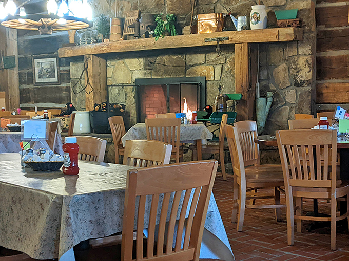 That stone fireplace isn't just for show&mdash;it's the heart of this dining room where generations of families have gathered to fuel up before mountain adventures.