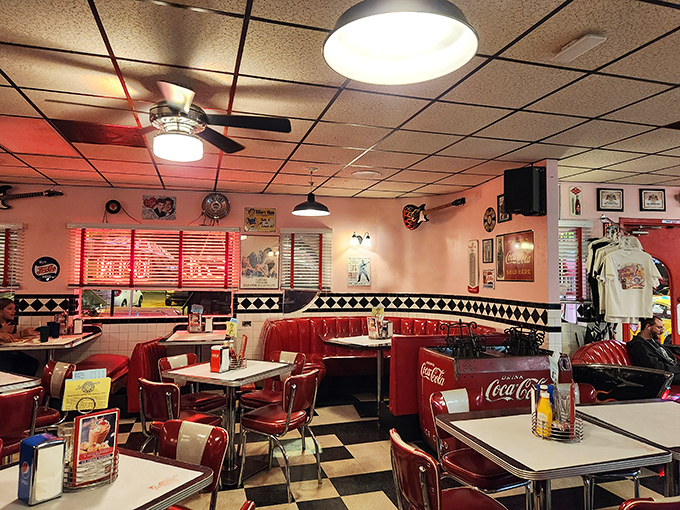 The ceiling fans lazily spinning above red booths and chrome tables create the perfect backdrop for conversations that somehow always taste better with a side of nostalgia.