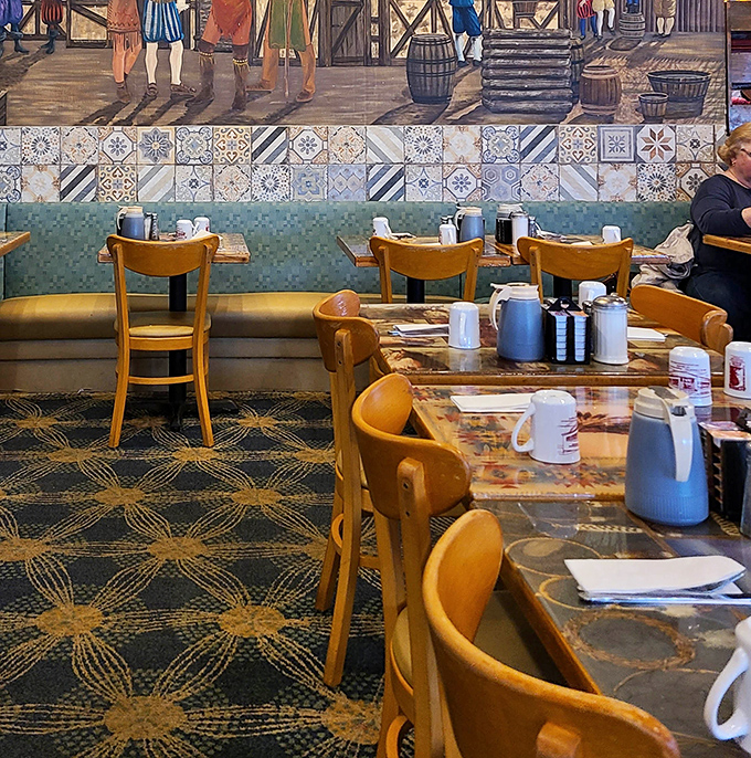 History meets hunger in this dining area where colonial-inspired murals watch over patrons making important decisions about syrup-to-butter ratios.
