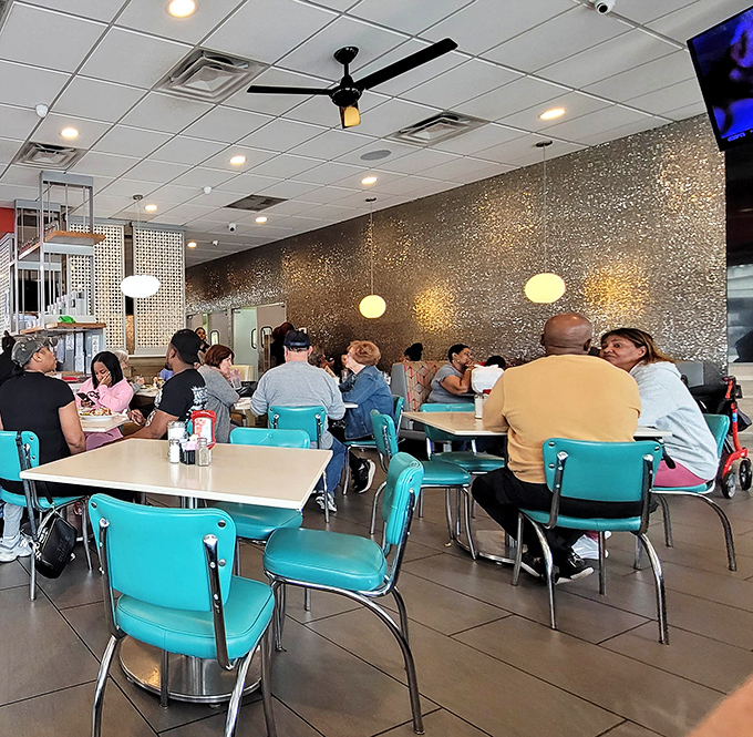 A dining room where strangers become neighbors, sharing the universal language of "mmm" and "you've got to try this."