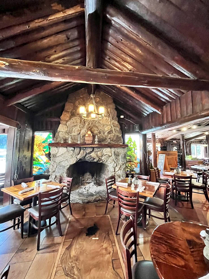 That stone fireplace isn't just architectural—it's the soul of the dining room. Imagine this place on a foggy Big Sur evening.