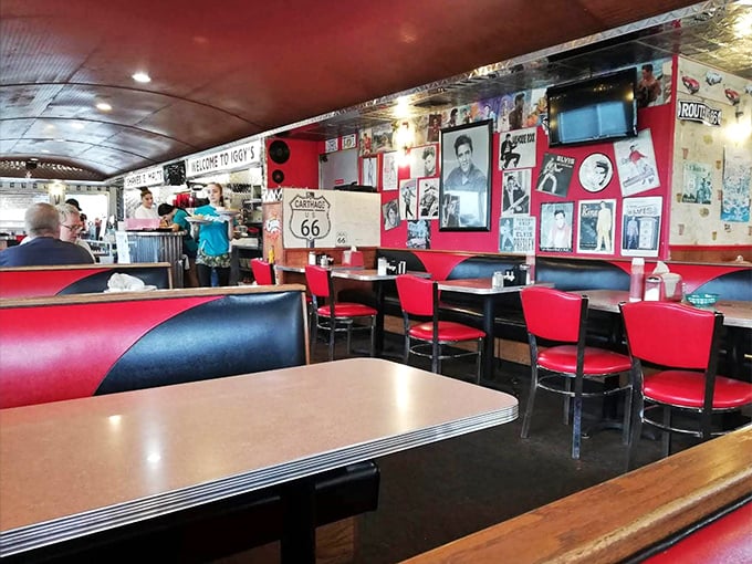 Red and black booths set against walls of nostalgia&mdash;where conversations flow as freely as the coffee refills.