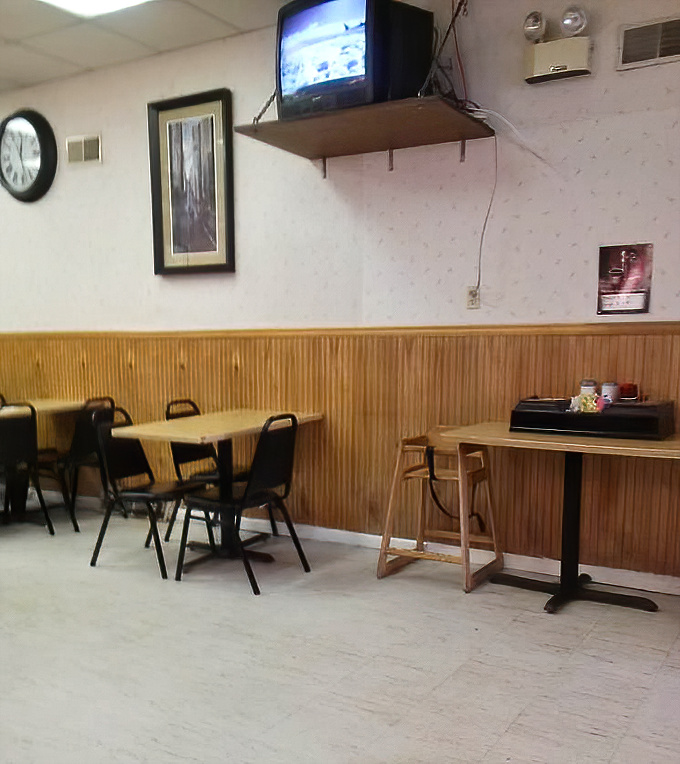 The dining area speaks volumes: we're here for the food, not the ambiance. Those wooden panels have witnessed countless moments of sandwich bliss.