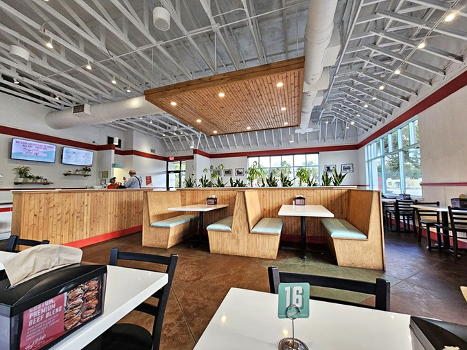 Wooden booths, clean lines, and that signature red stripe&mdash;Hugh-Baby's dining area feels like the perfect blend of nostalgic diner and modern eatery.