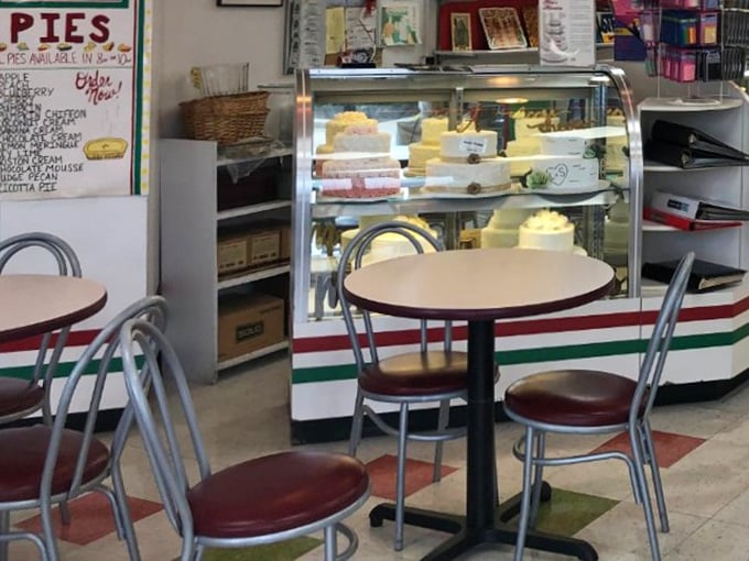 The modest dining area says, "Stay awhile, make friends with your pastry." Some of life's greatest pleasures happen at these unassuming tables.