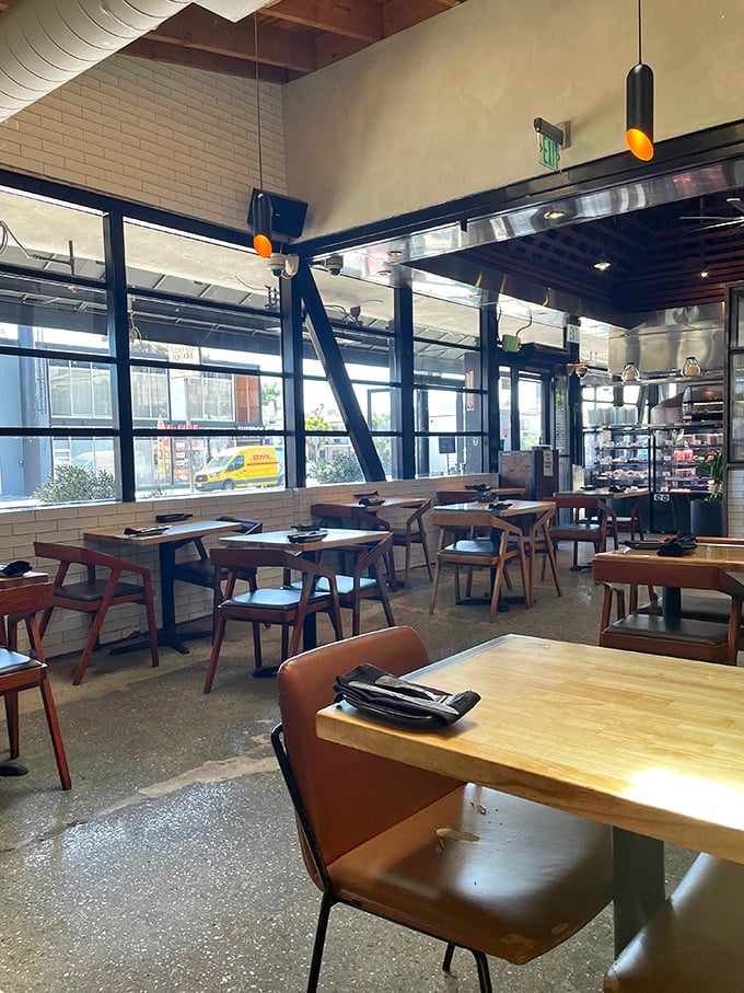 The dining area balances industrial elements with warmth&mdash;like the culinary equivalent of your cool friend who's surprisingly down-to-earth.