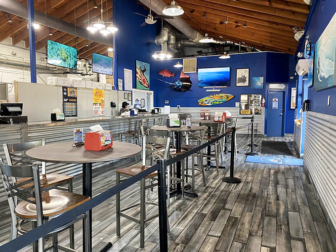 High-top tables and nautical blue walls create the perfect casual vibe. This isn't dining—it's an experience where memories are made between bites.