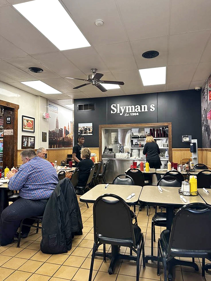 From this angle, you can almost hear the conversations about how nobody's finishing their sandwich in one sitting. The ceiling fans keep the air moving while taste buds celebrate.