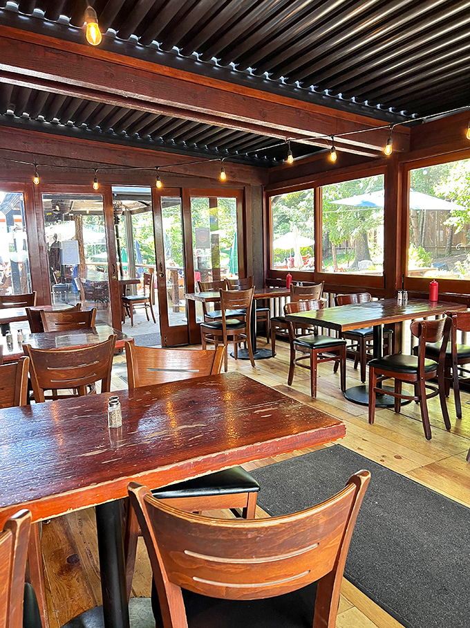 String lights, wooden beams, and picture windows bringing nature indoors&mdash;dining here feels like being in a treehouse for grown-ups.