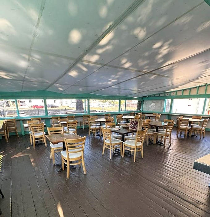 Dappled sunlight plays across wooden tables, creating nature's own Instagram filter. The calm before the delicious storm.