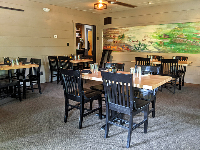 Another dining area showcases rustic charm with a pastoral mural that whispers, "Slow down, you're in Indiana now&mdash;savor the moment."