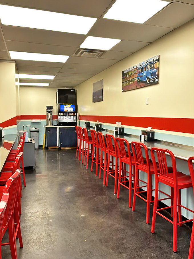 The counter seating offers a front-row view to burger artistry. Like watching Picasso, but with beef patties.
