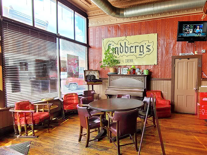 Red chairs that have cradled countless conversations, beneath a sign that promises exactly what you need &ndash; food and drink.