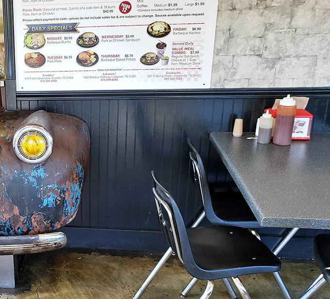 Every sauce bottle tells a story, every table holds a memory. That weathered truck front hints at the vintage approach to barbecue that makes Stroud's special.