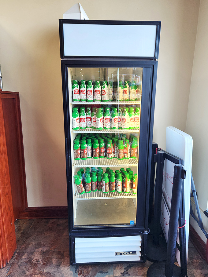 The beverage cooler stands ready to provide the perfect liquid companion to your pastry adventure. Because great donuts deserve proper hydration.