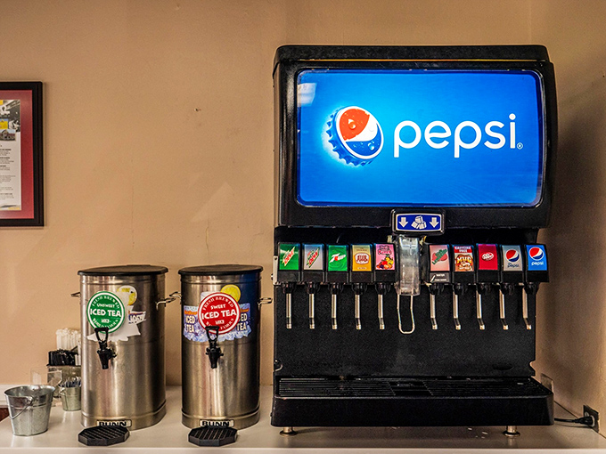The soda fountain—where sweet tea flows like liquid gold and Pepsi products stand ready to cut through all that glorious fried goodness.