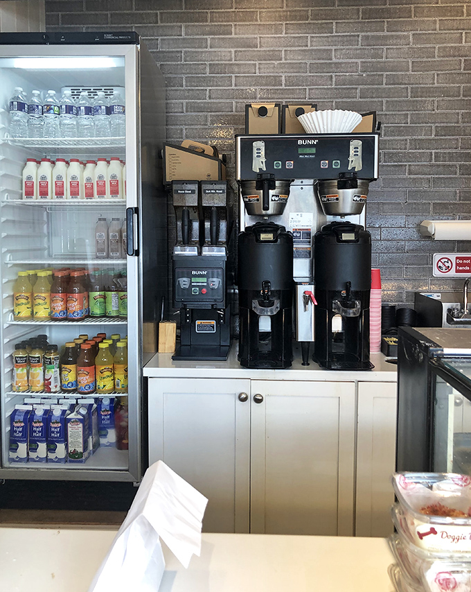 The coffee station stands ready like a loyal sidekick, prepared to balance your sweet indulgence with caffeinated perfection.