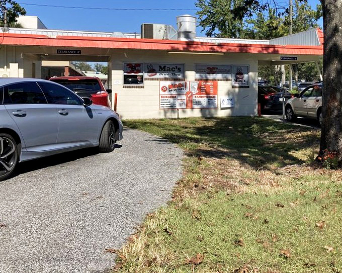 The drive-thru lane at Mac's: where Gainesville professors, students, and construction workers find common ground in burger appreciation.