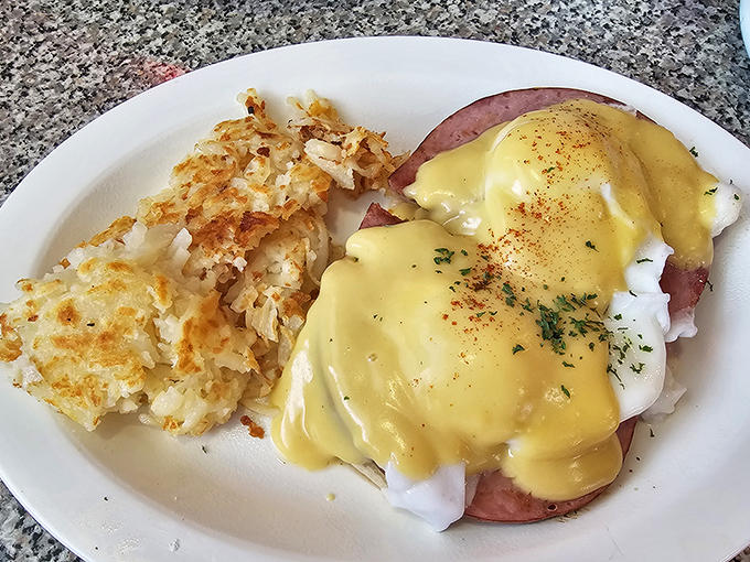 Eggs Benedict that balances perfectly between decadence and breakfast necessity. That hollandaise sauce looks like liquid sunshine on a plate.